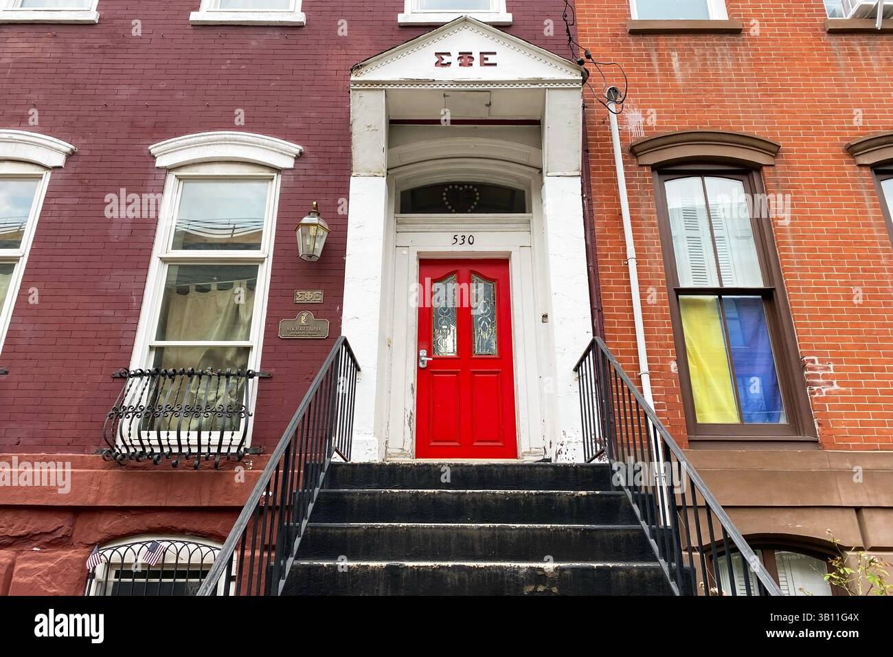Manhattan row houses with classic brownstone look and city architecture ...