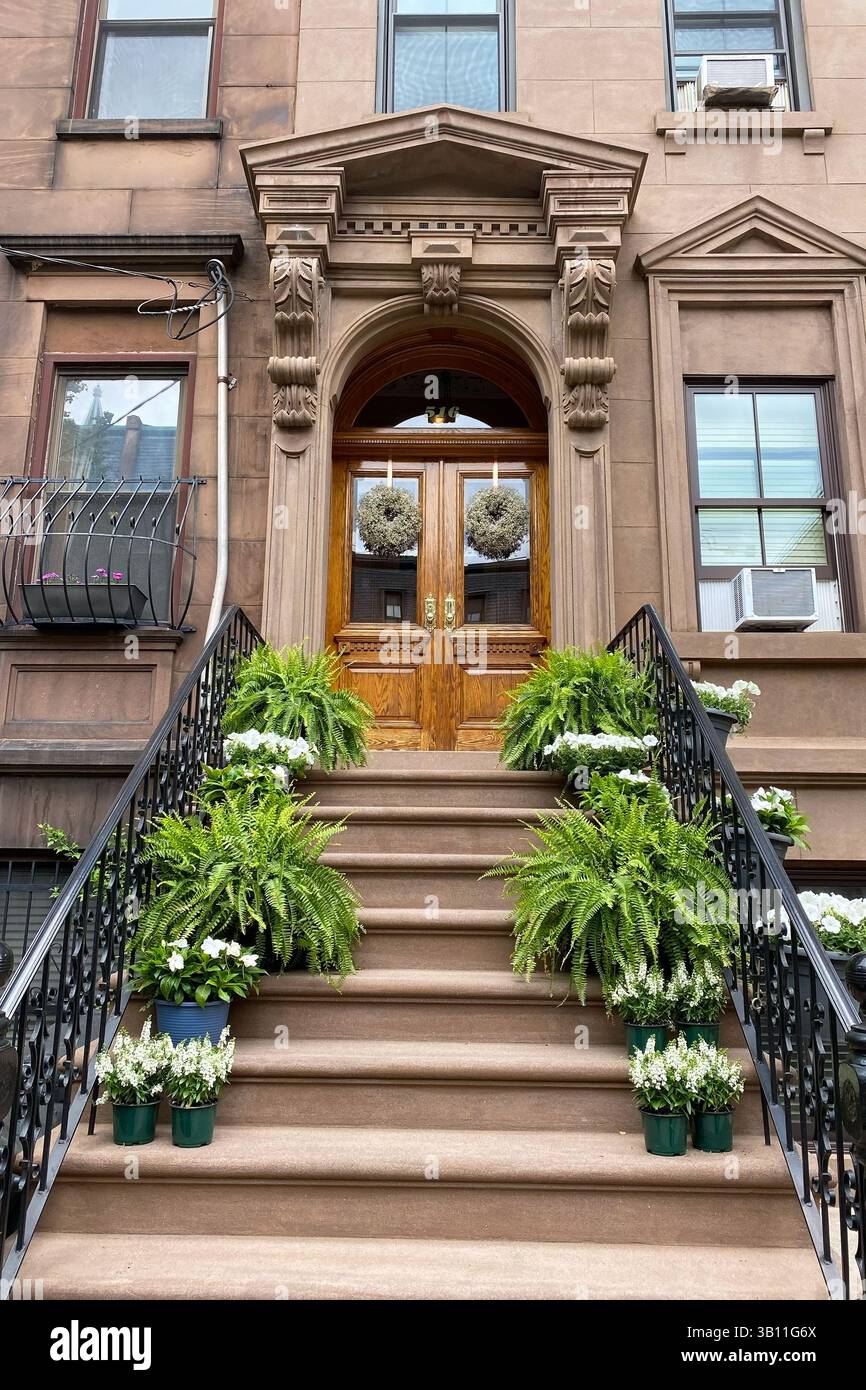 Brownstone street in New York with heritage homes and city vibes Stock ...