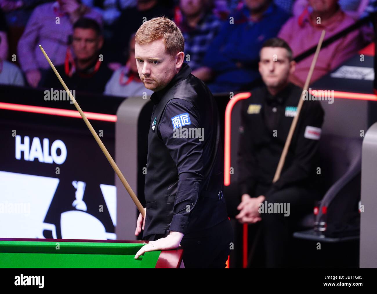 Ben Woollaston (left) during his match with Mark Selby (right) on day ...