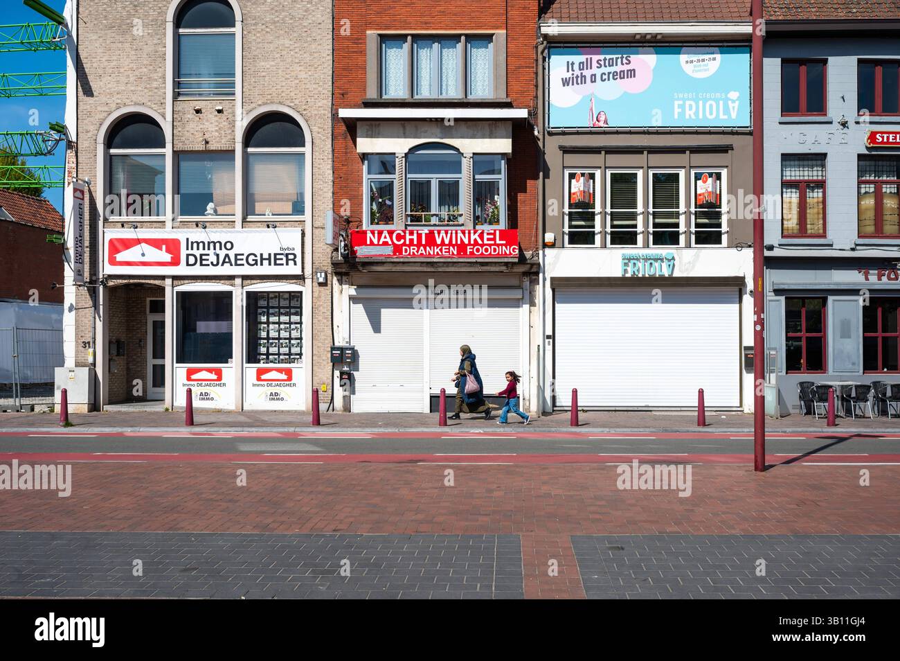 Local shops at the Grte Markt or central market of Menen, West Flanders ...