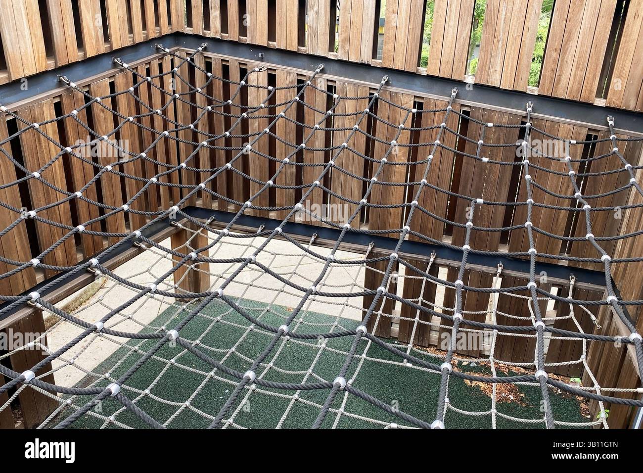 Close-up of a hanging net in a children’s playground, highlighting ...