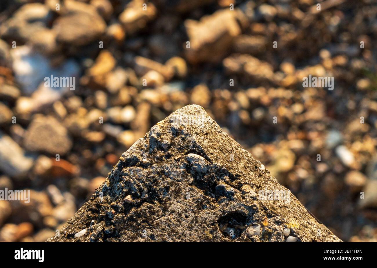 Edge of the Moment: Triangle Stone in Focus. Looking down Stock Photo ...