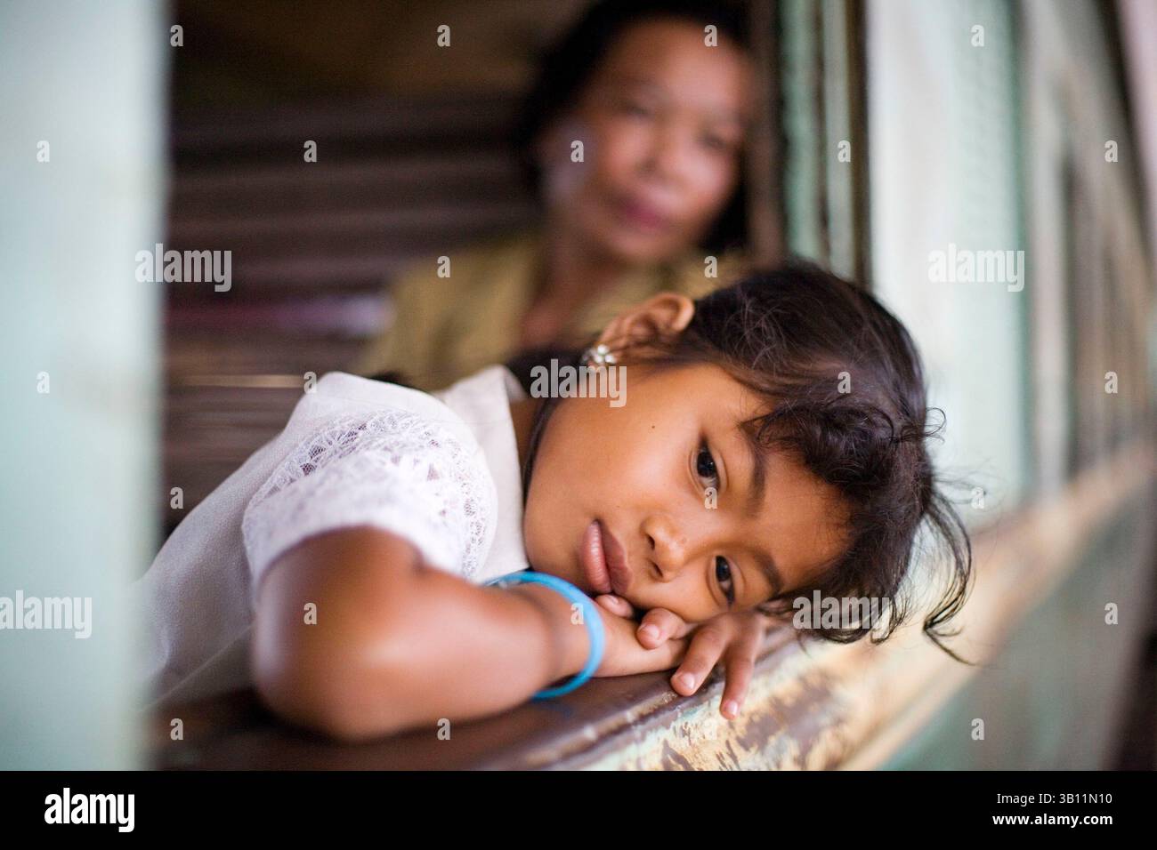 Jul. 01, 2006 - Phnom Penh, Cambodia - A girl and her mother on the train from Phnom Penh to ...