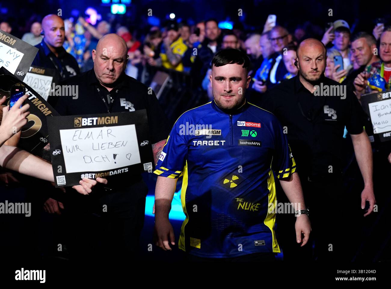 Luke Littler walks on ahead of of his match against Michael van Gerwen ...