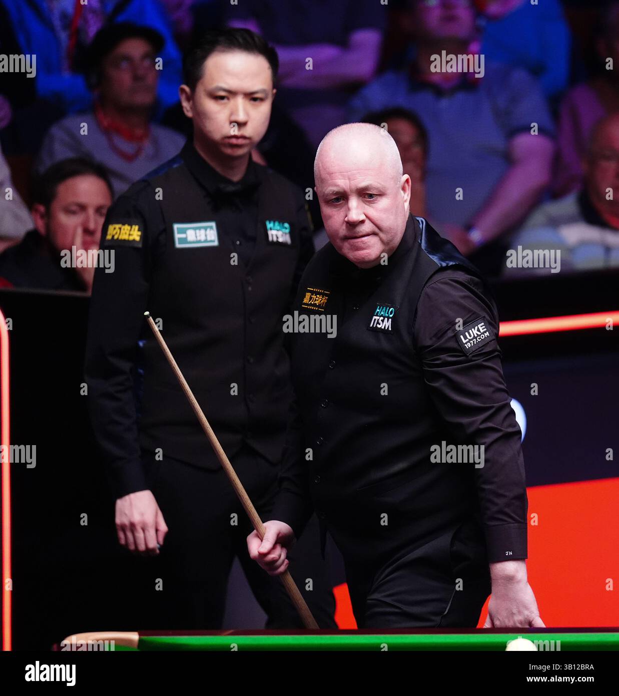 John Higgins (right) during his match with Xiao Guodong (left) on day ...