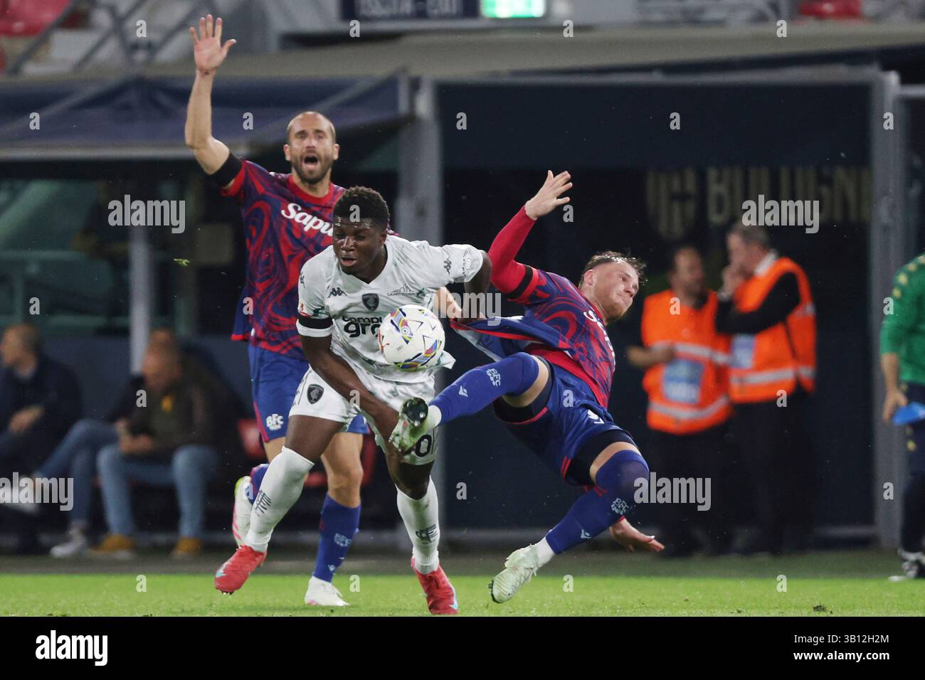 Empoli's Ismael Konate, center, fights for the ball with Bologna's Sam ...
