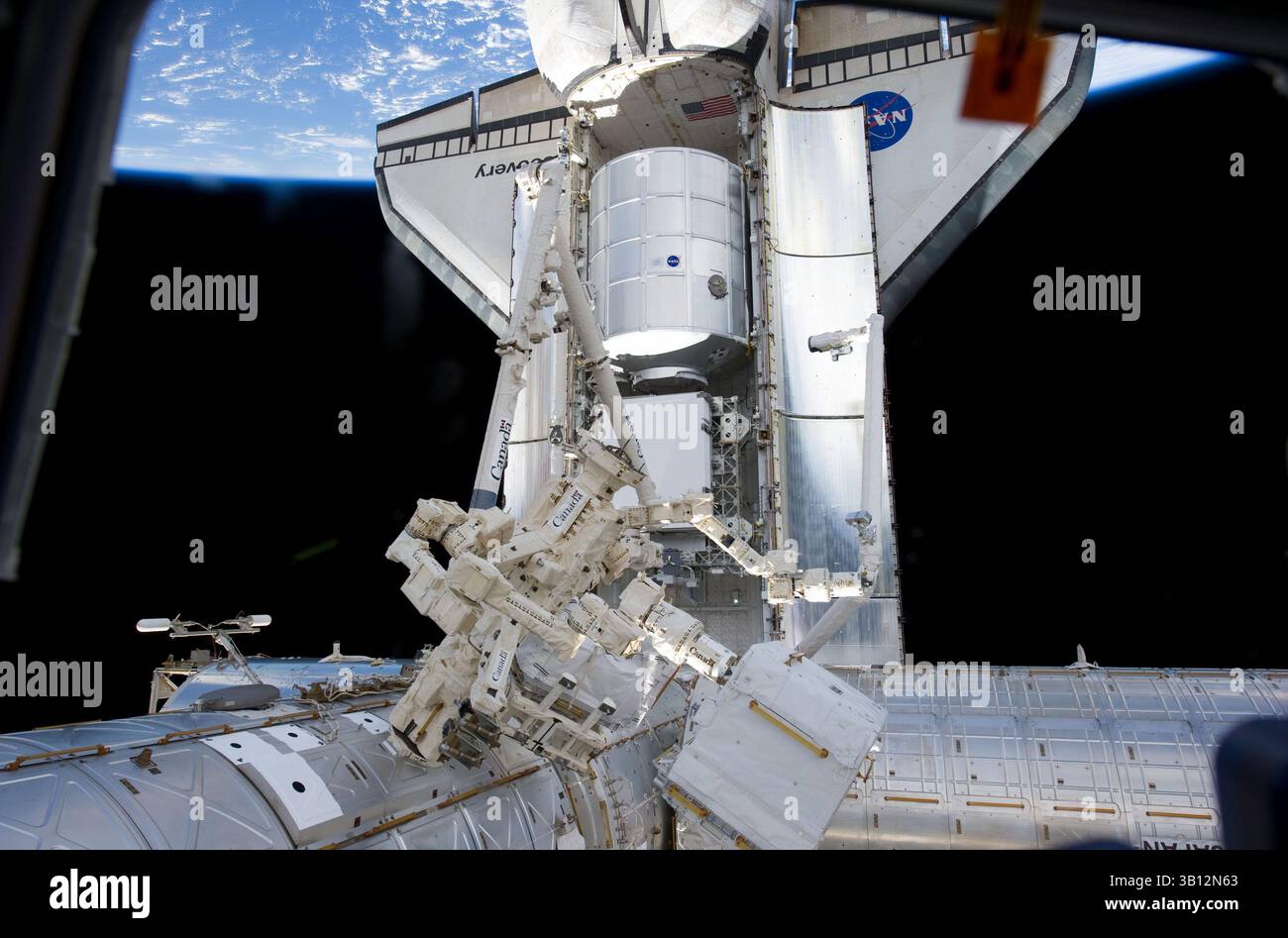 Mar 02, 2011 - International Space Station, U.S. - Conjoined. The docked space shuttle Discovery ...
