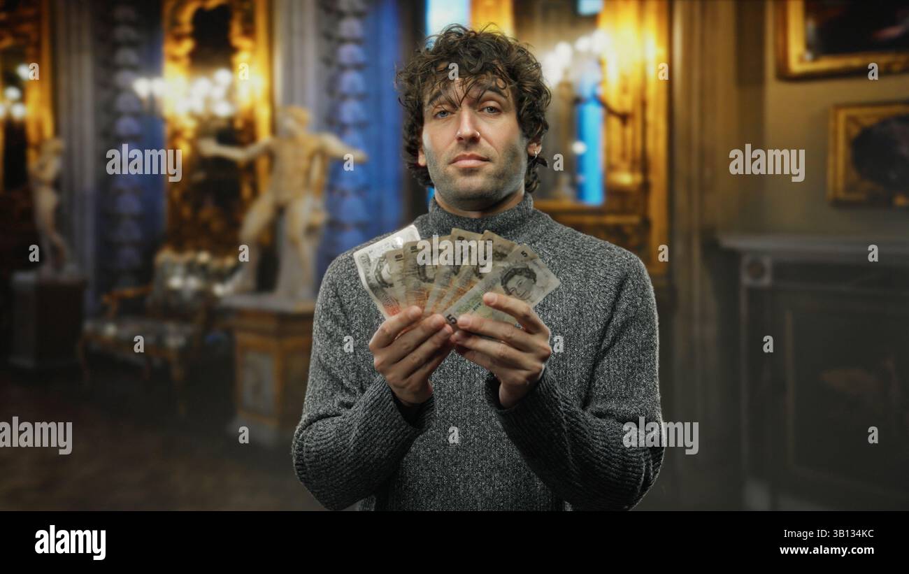 Hispanic man holding english pound banknotes indoors against ornate ...