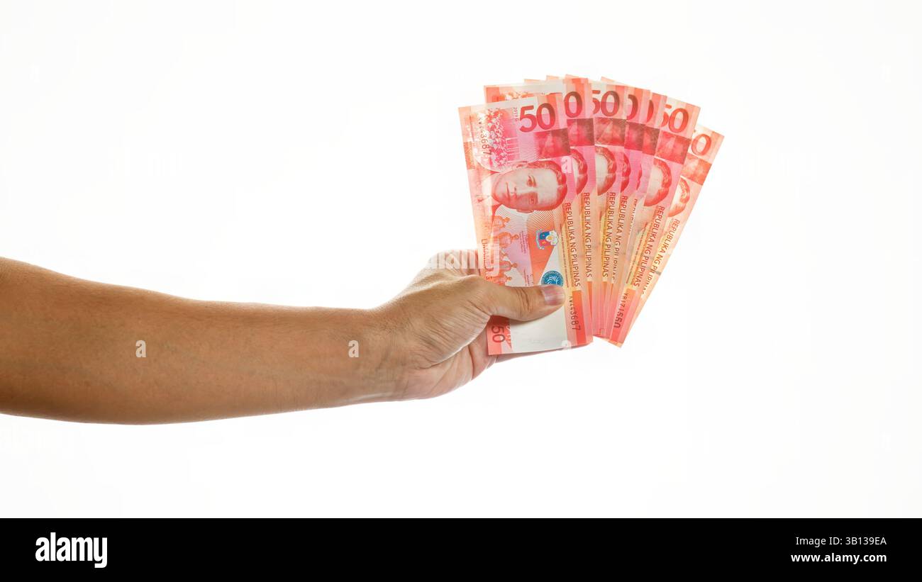 Hand holding philippine pesos isolated over white background Stock ...