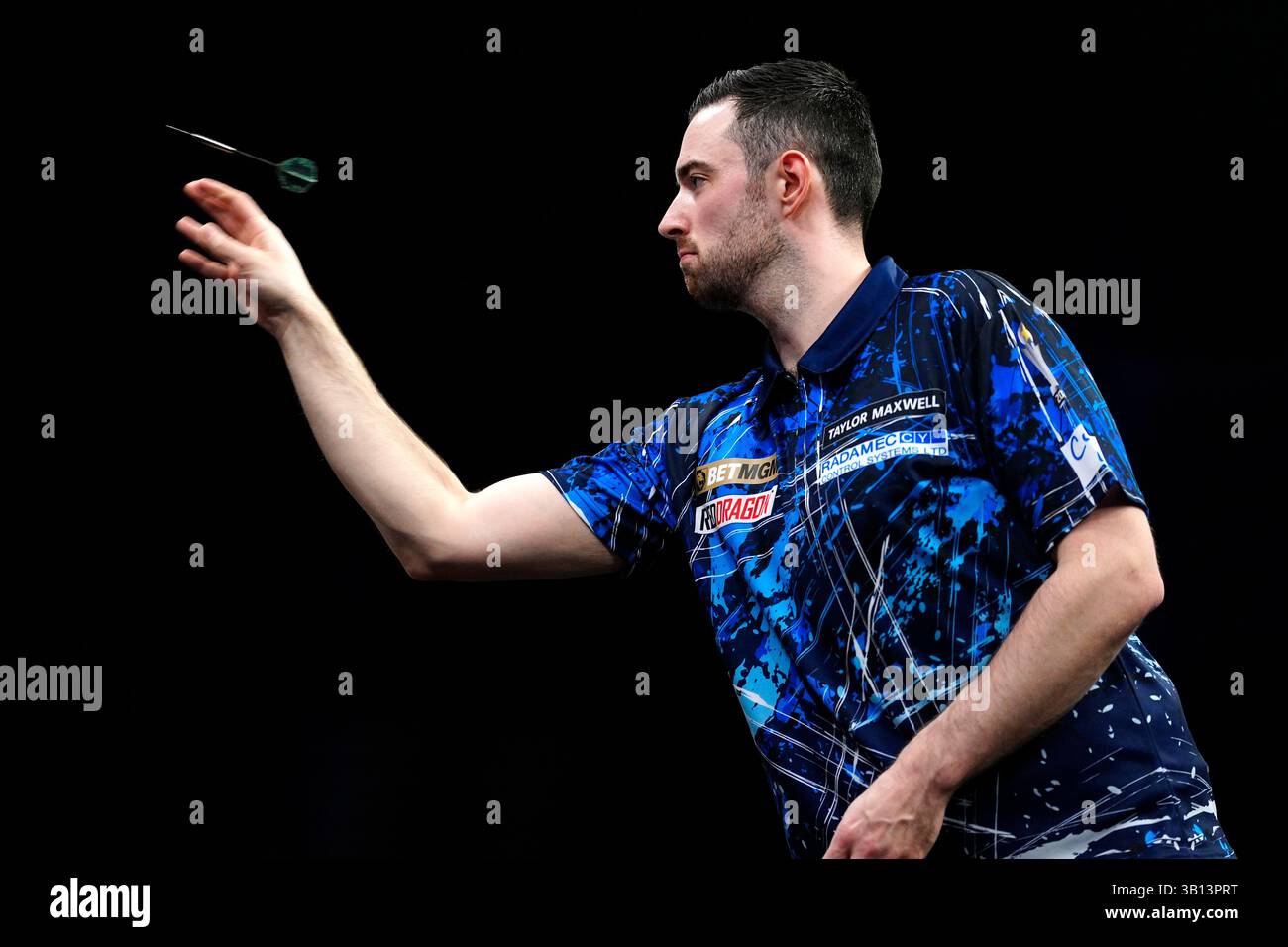 Luke Humphries in action against Michael van Gerwen (not pictured ...