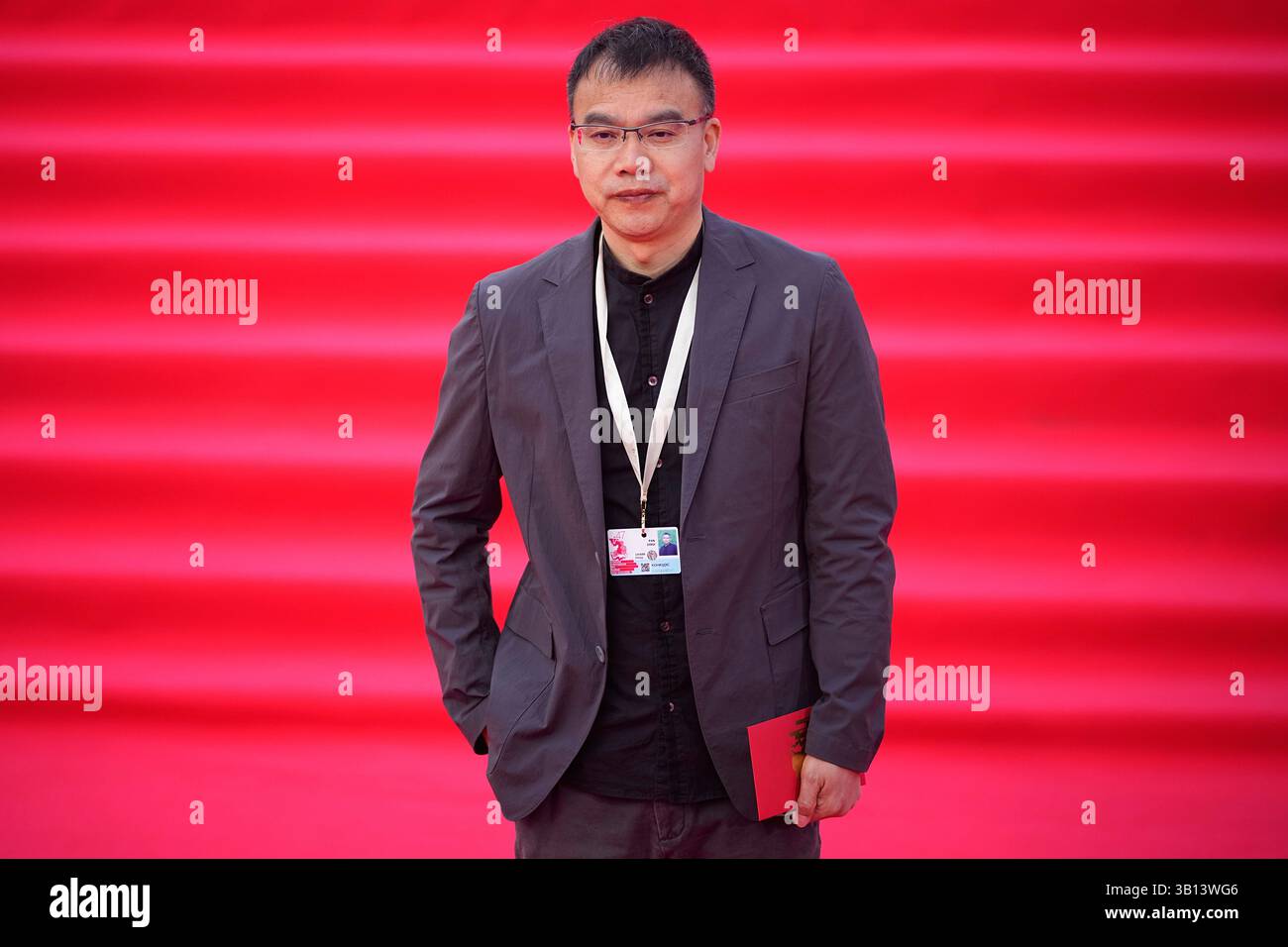 Chinese director Pan Zhiqi poses for photographers upon arrival at the ...