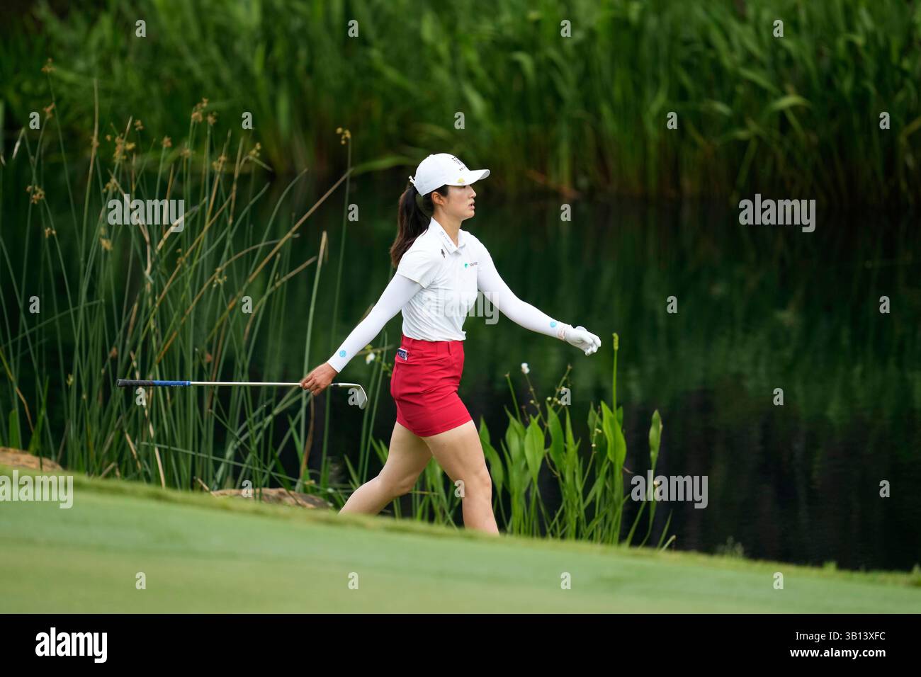 Yu Liu, of China, walks on the 17th hole during the first round of the ...