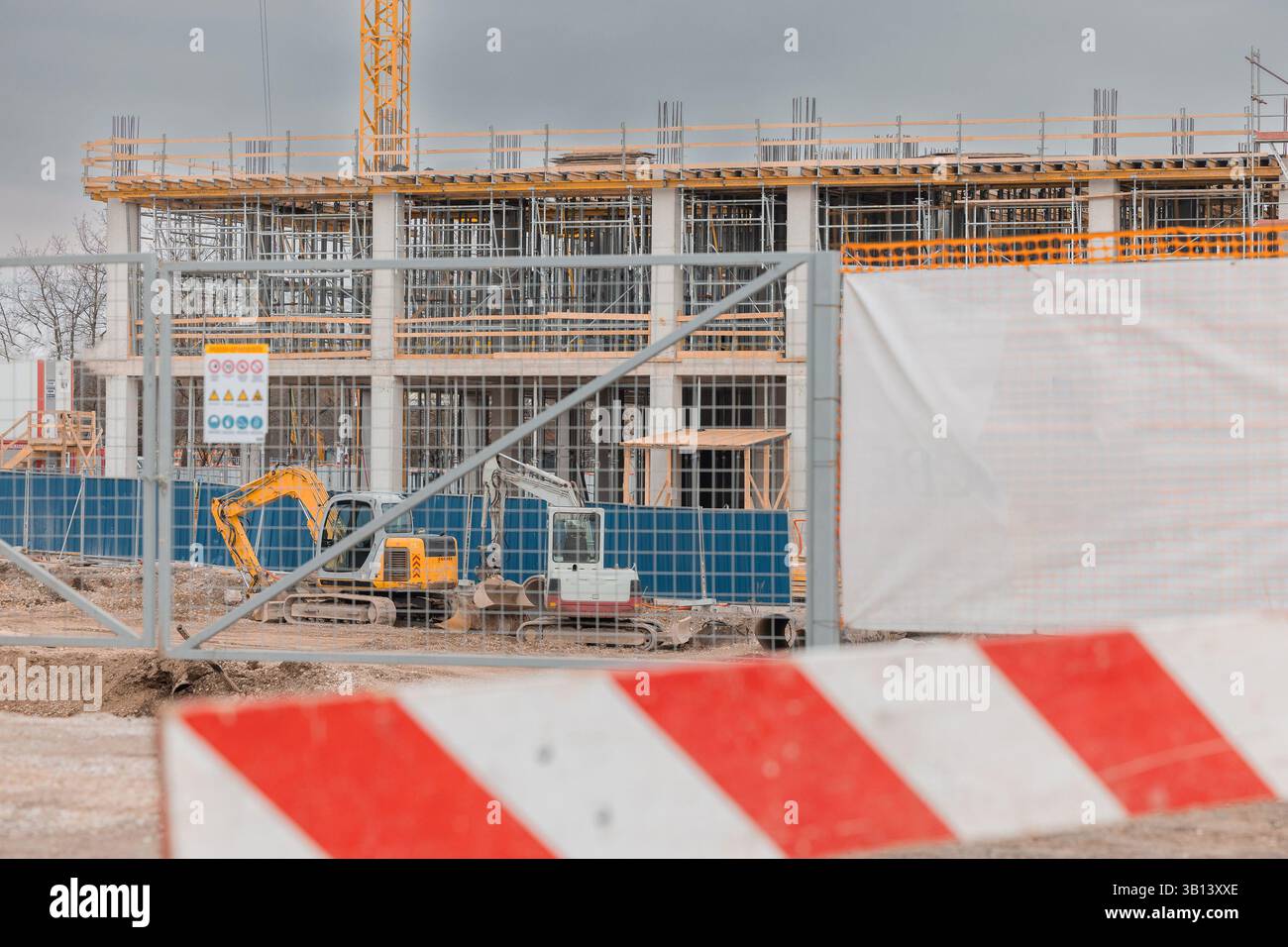 A construction site with a multi-story building under construction ...