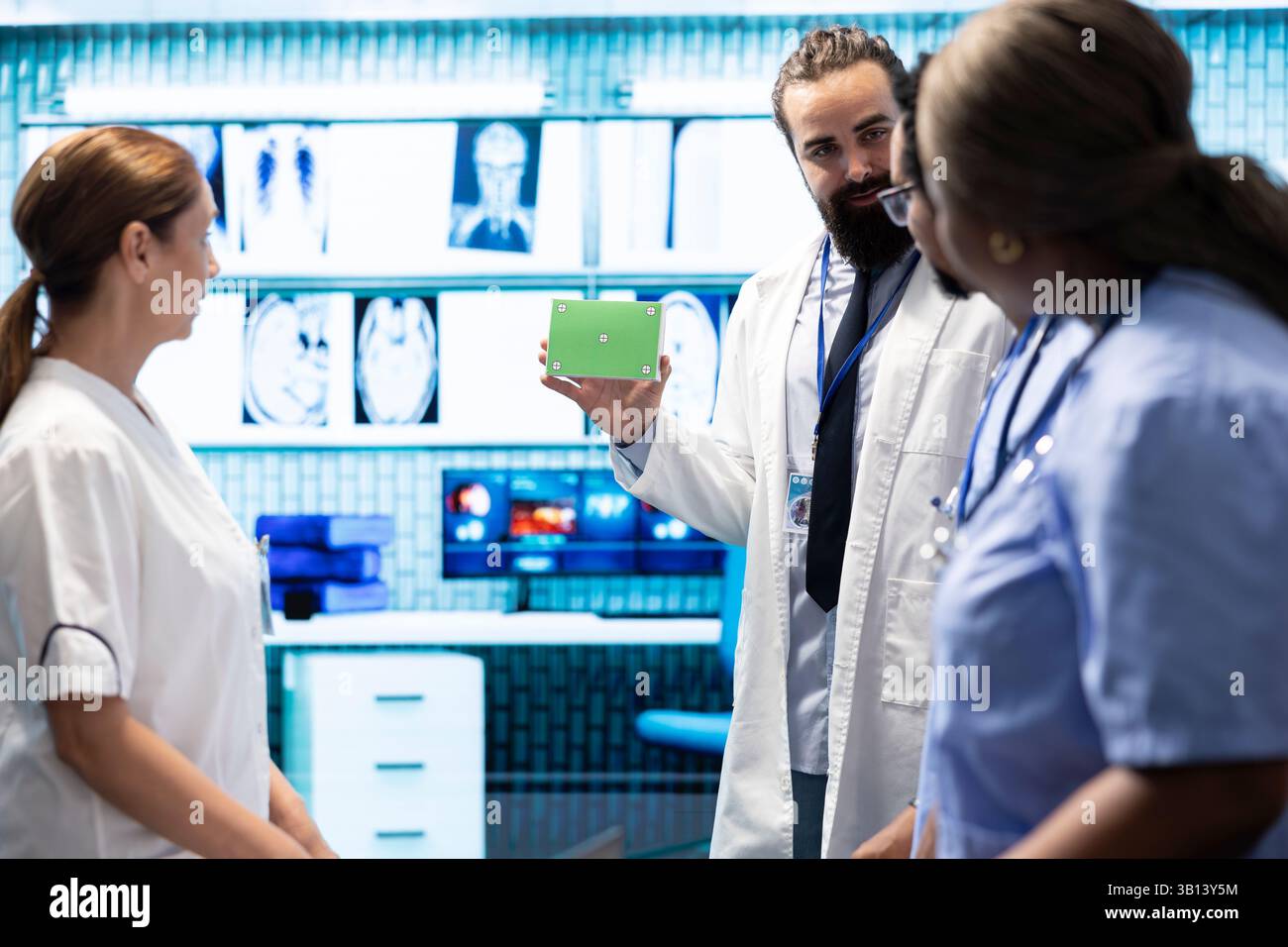 Medical expert showing a box with green screen during a meeting for ...