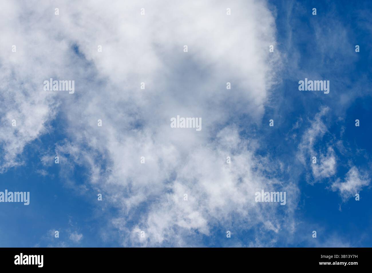 The image displays a bright blue sky dotted with various shapes and ...
