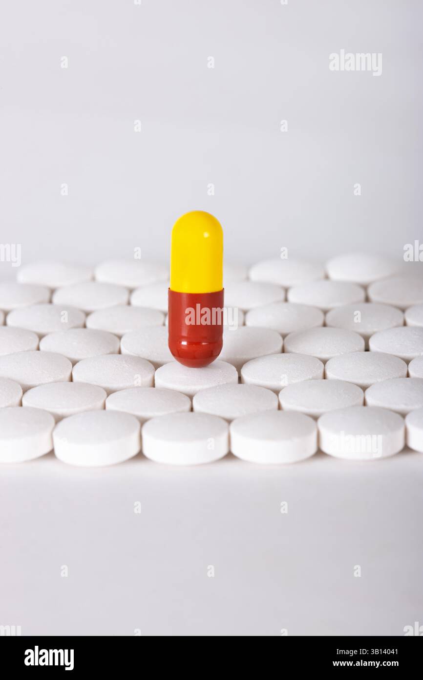 capsule with reflection pharmaceutical with medication , single yellow ...