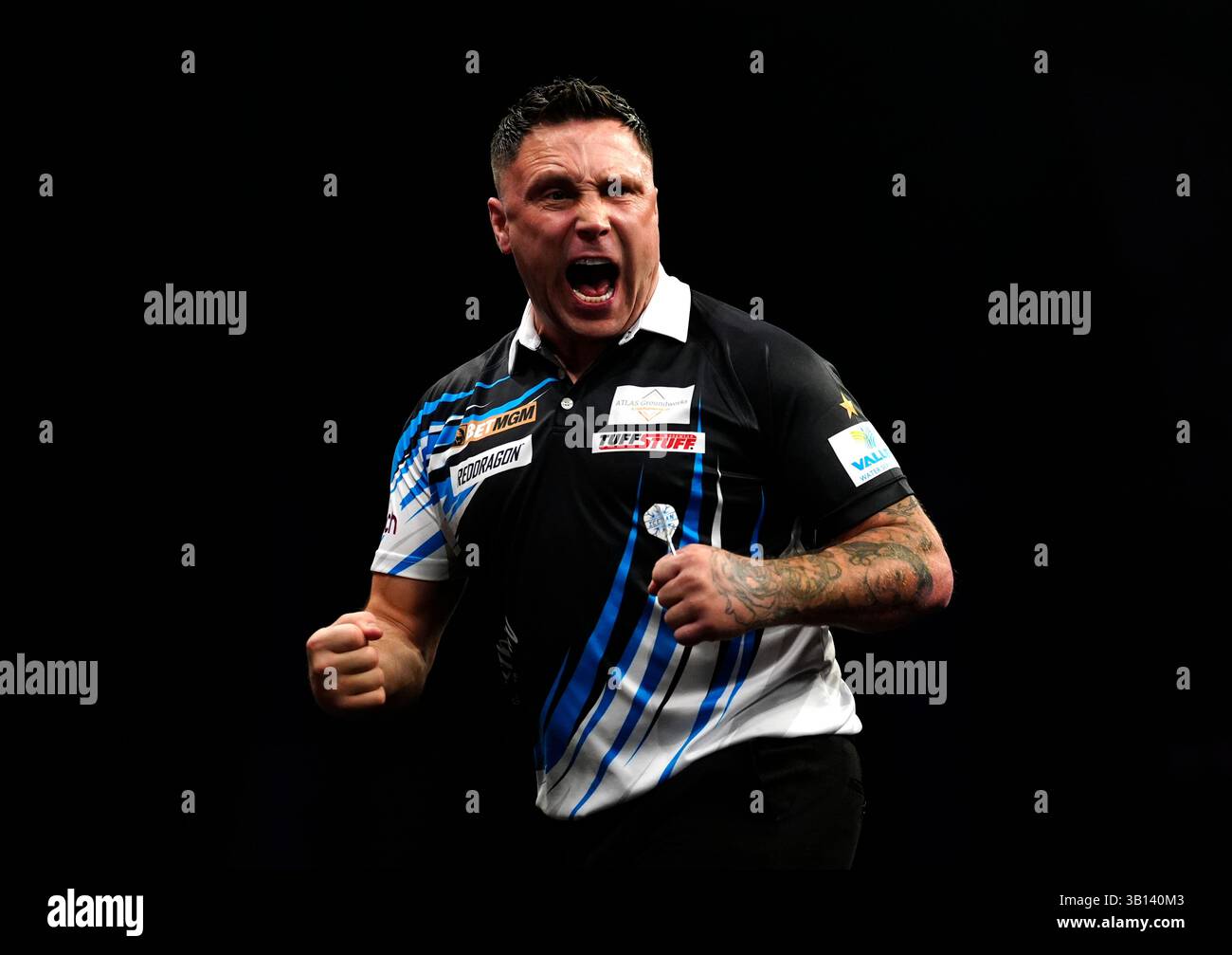 Gerwyn Price reacts in his match against Luke Humphries (not pictured) during night twelve of ...