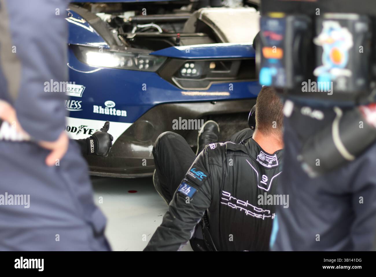 Imola, Italy. 20th Apr, 2025. Mechanics service the broken front fender ...