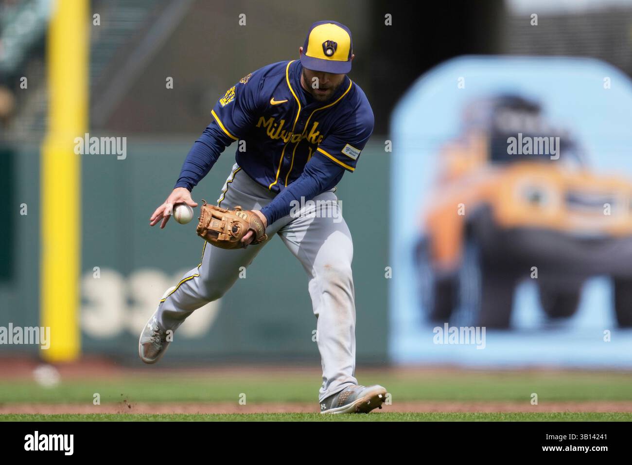 Milwaukee Brewers third baseman Vinny Capra makes a fielding error on a ...