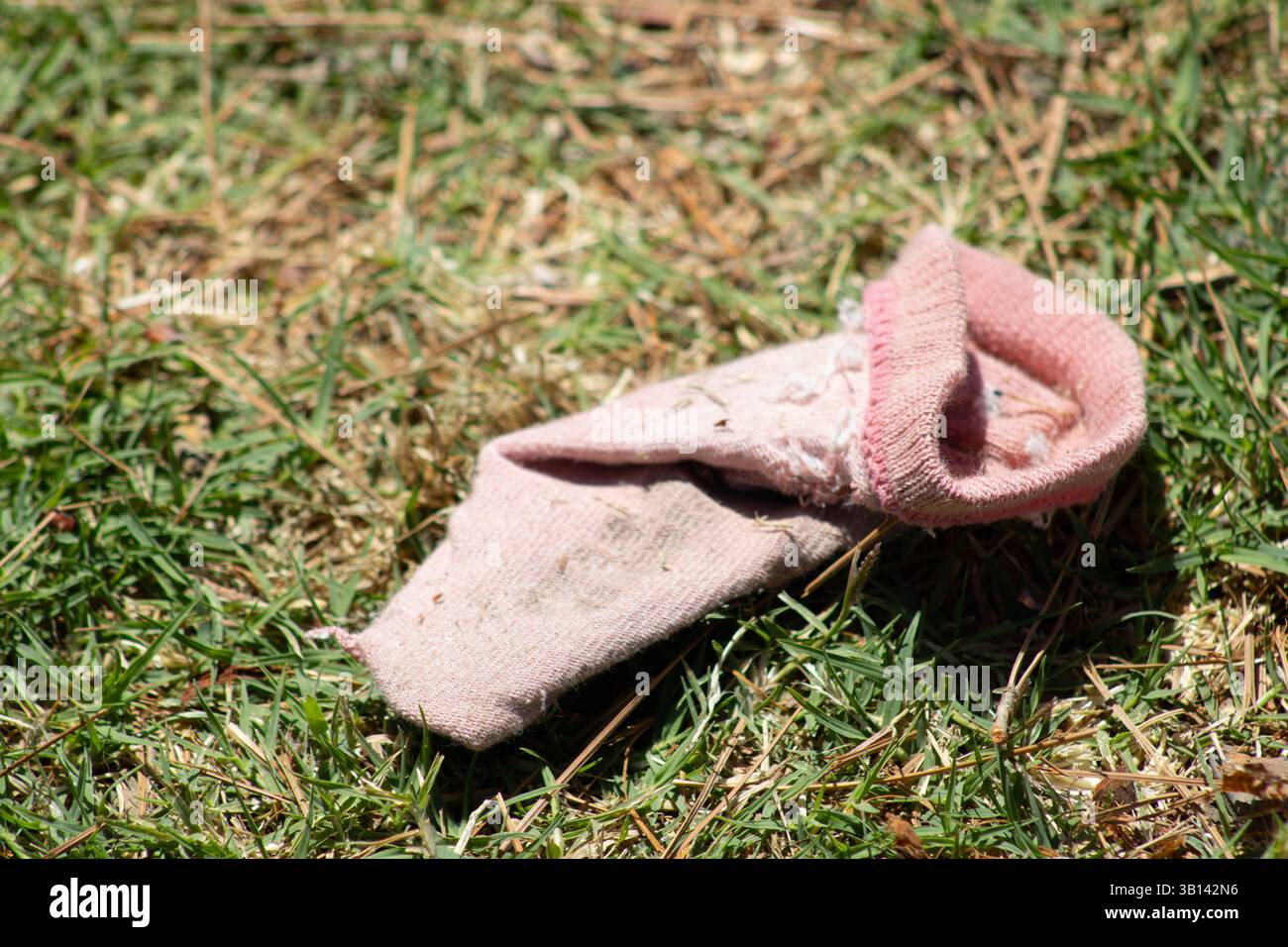 inside out lost pink sock Stock Photo - Alamy