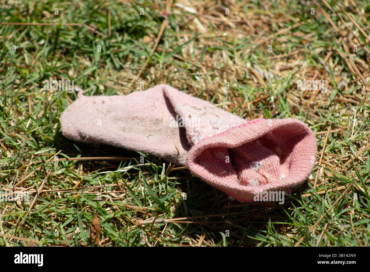 inside out lost pink sock Stock Photo - Alamy