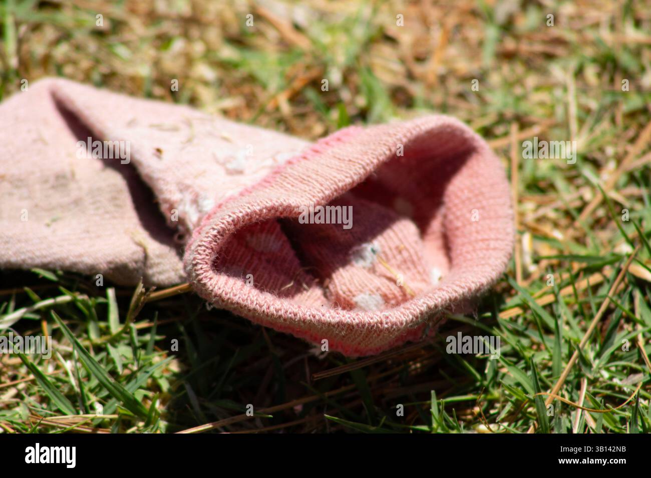 inside out lost pink sock Stock Photo - Alamy