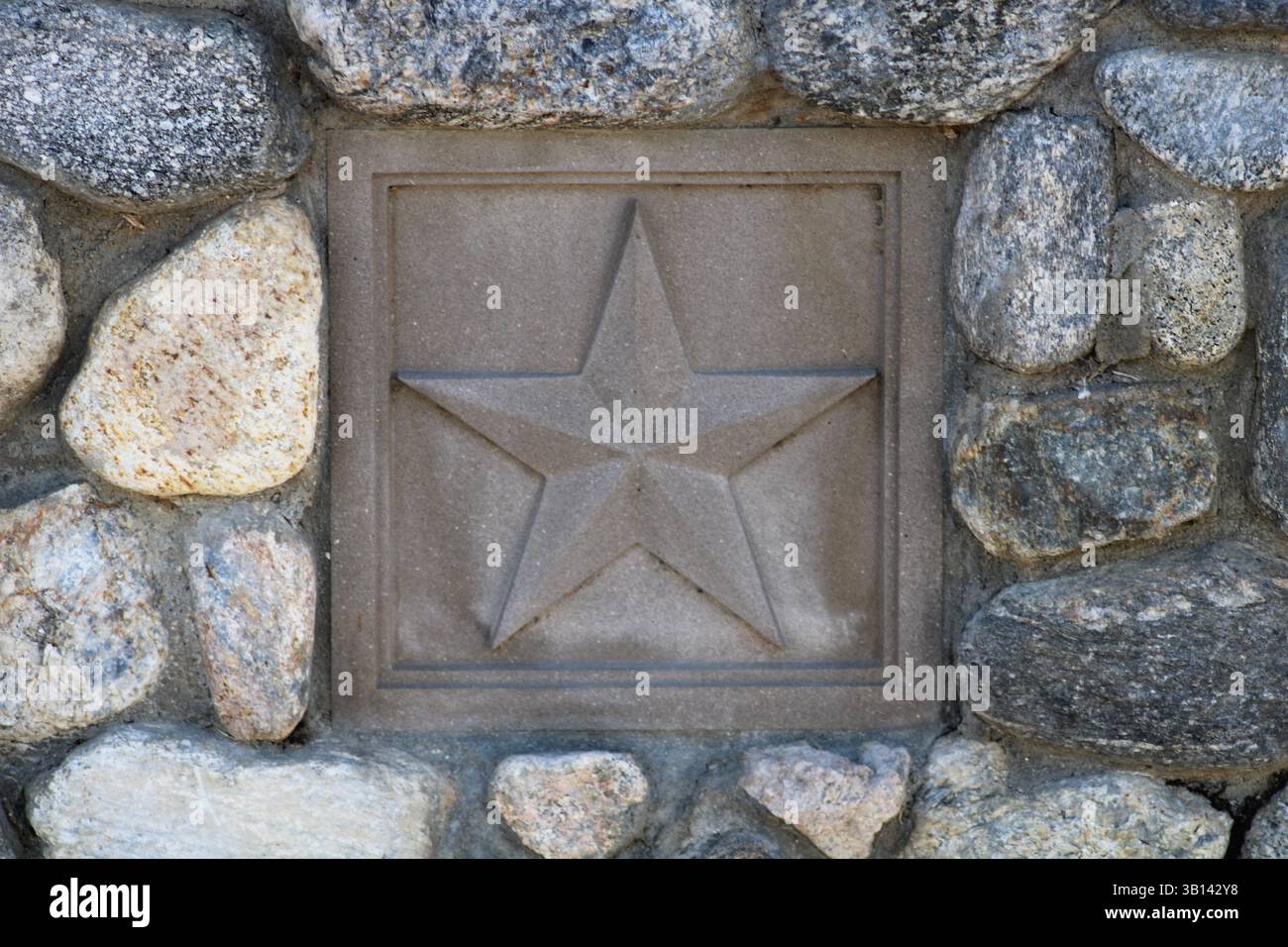 stone wall with star decoration Stock Photo - Alamy