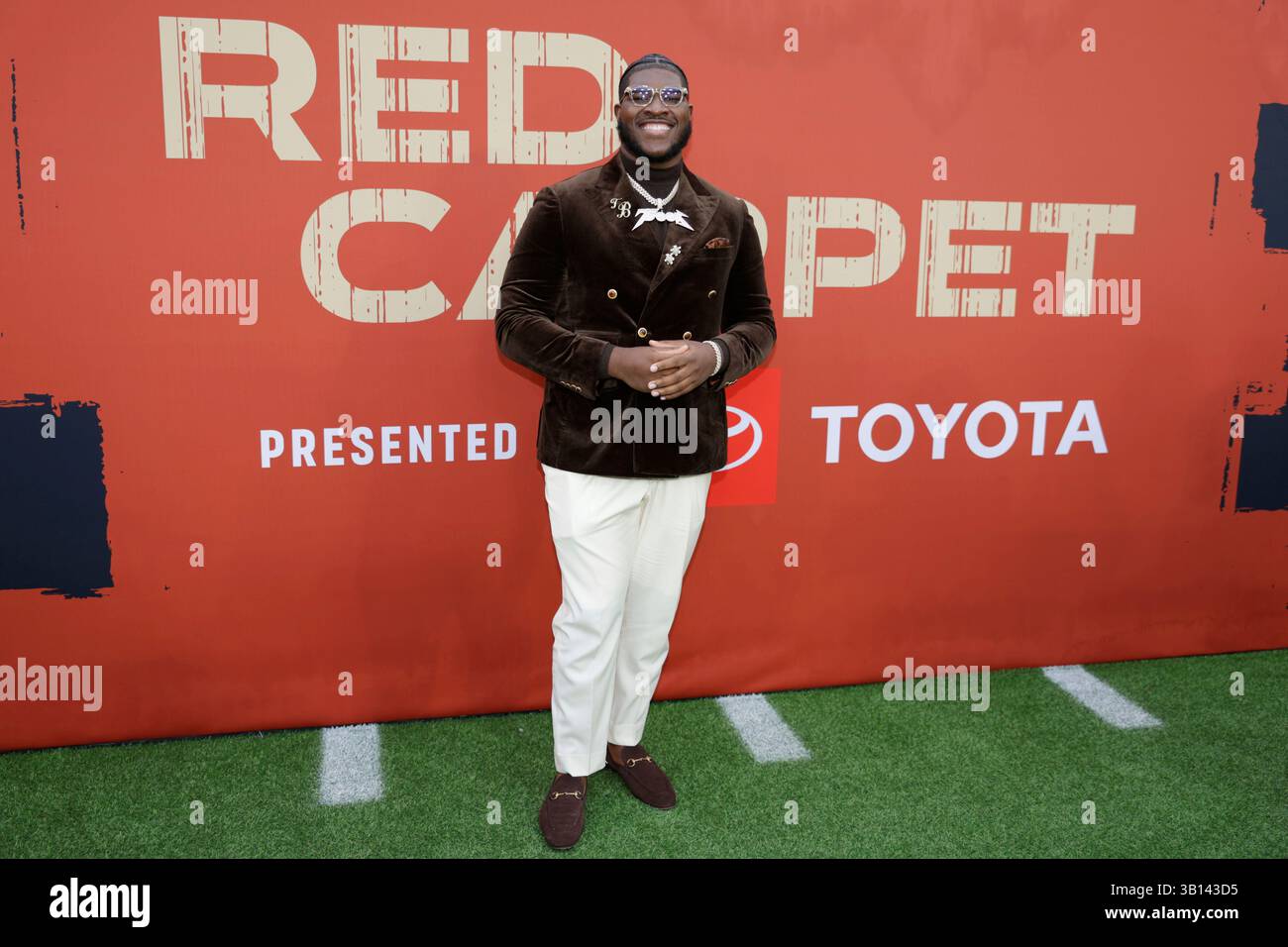 Alabama offensive lineman Tyler Booker poses on the carpet before first ...