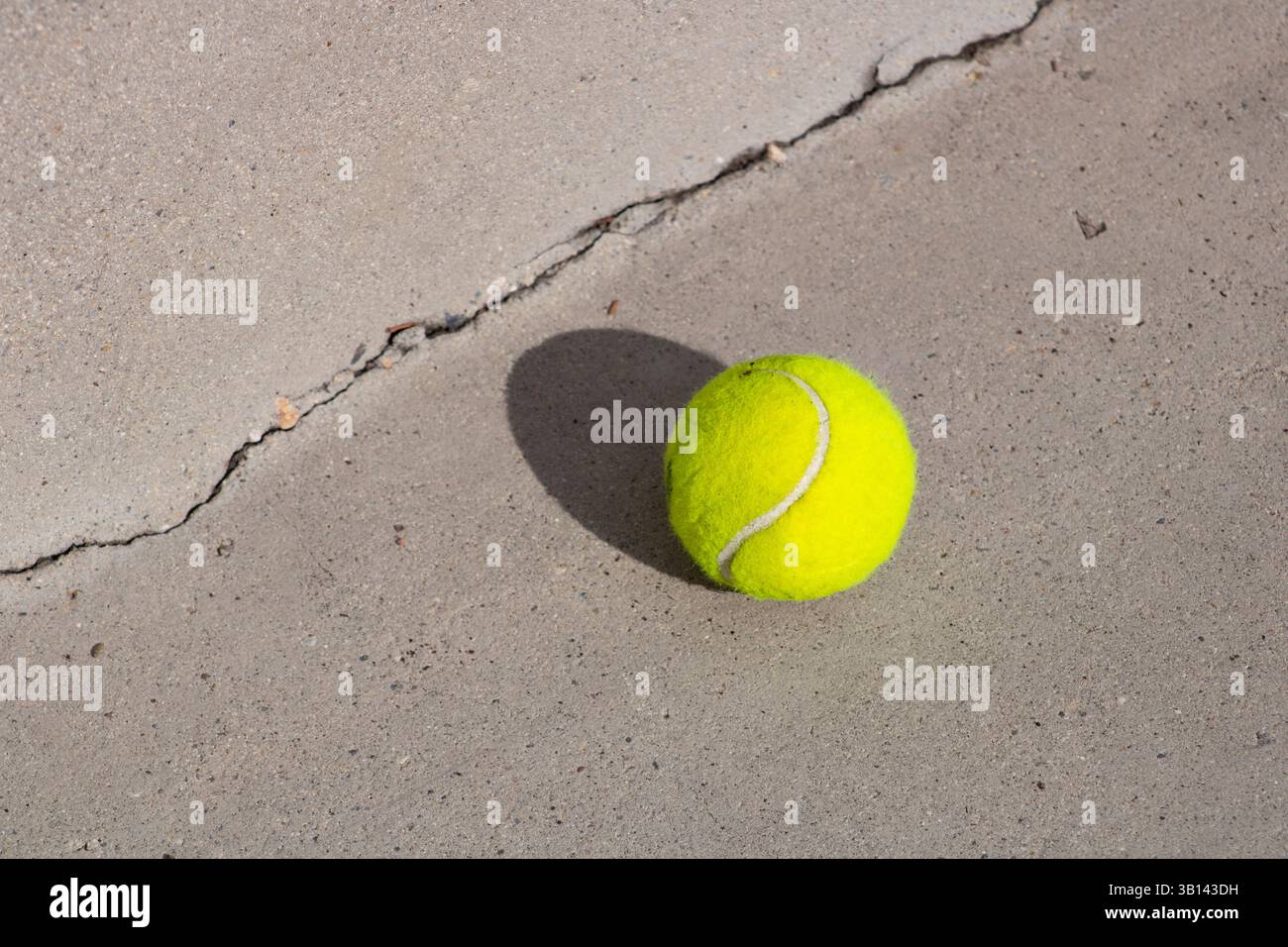 neon yellow tennis ball outdoors Stock Photo - Alamy