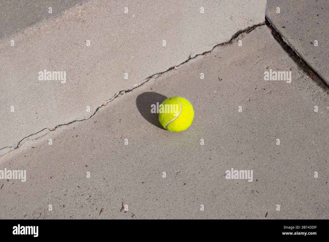 neon yellow tennis ball outdoors Stock Photo - Alamy