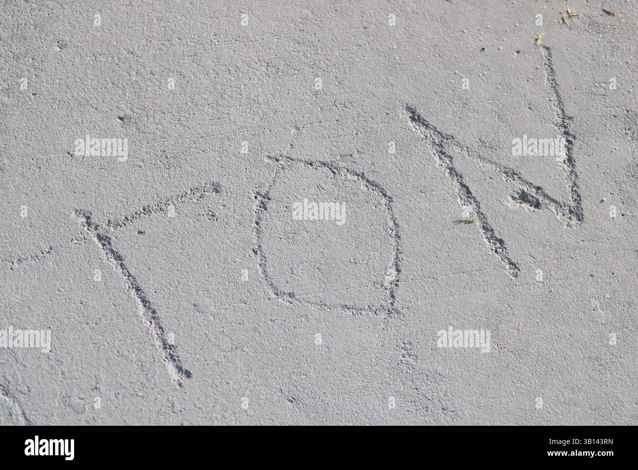 letters carved into pavement cement Stock Photo - Alamy