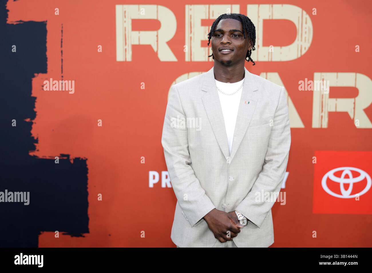 Miami quarterback Cameron Ward poses on the carpet before first round ...