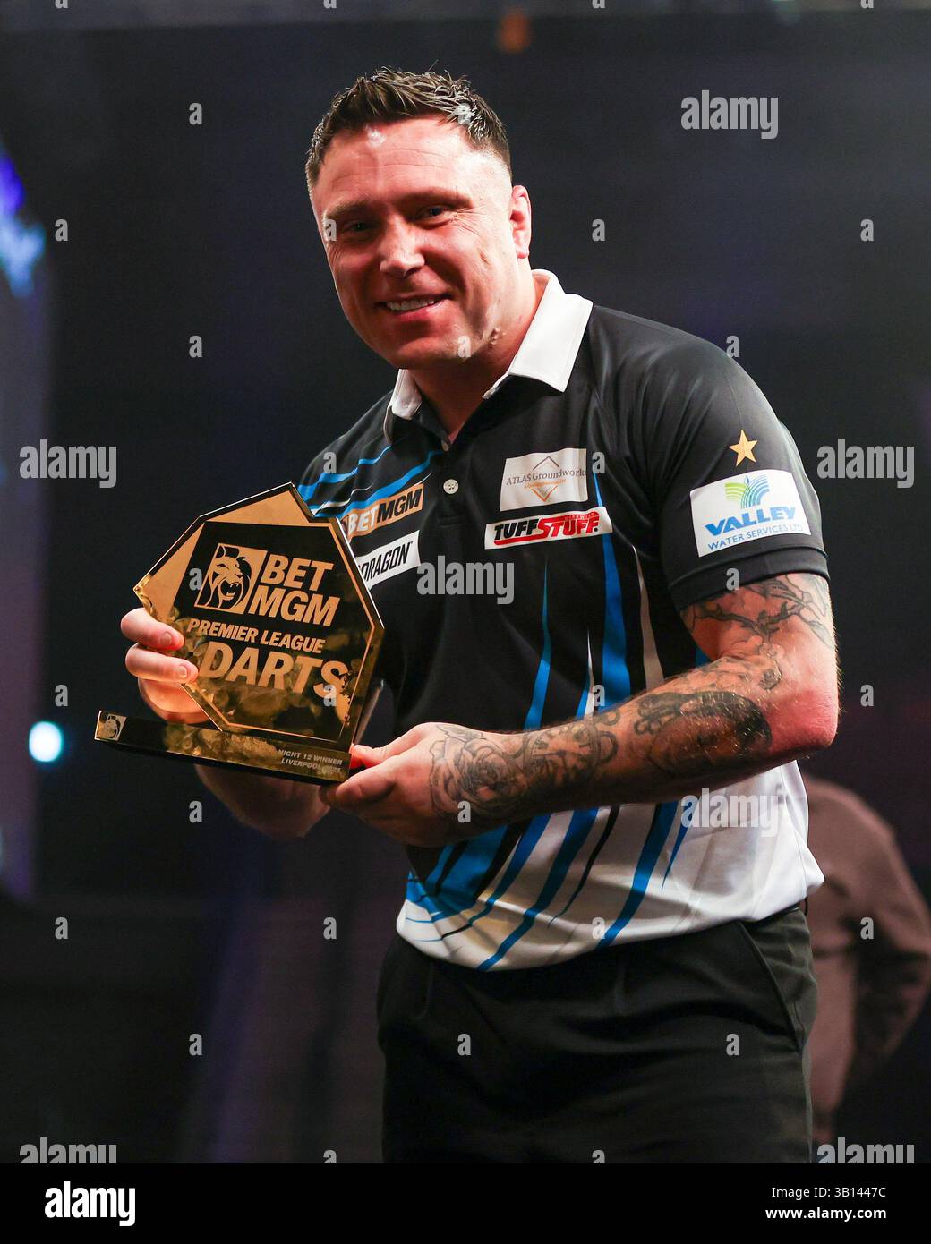 Liverpool, UK. 24th Apr, 2025. Gerwyn Price celebrates winning with the ...