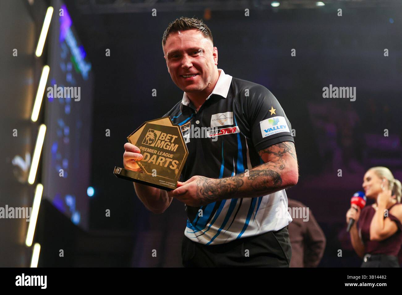 Liverpool, UK. 24th Apr, 2025. Gerwyn Price celebrates winning with the ...