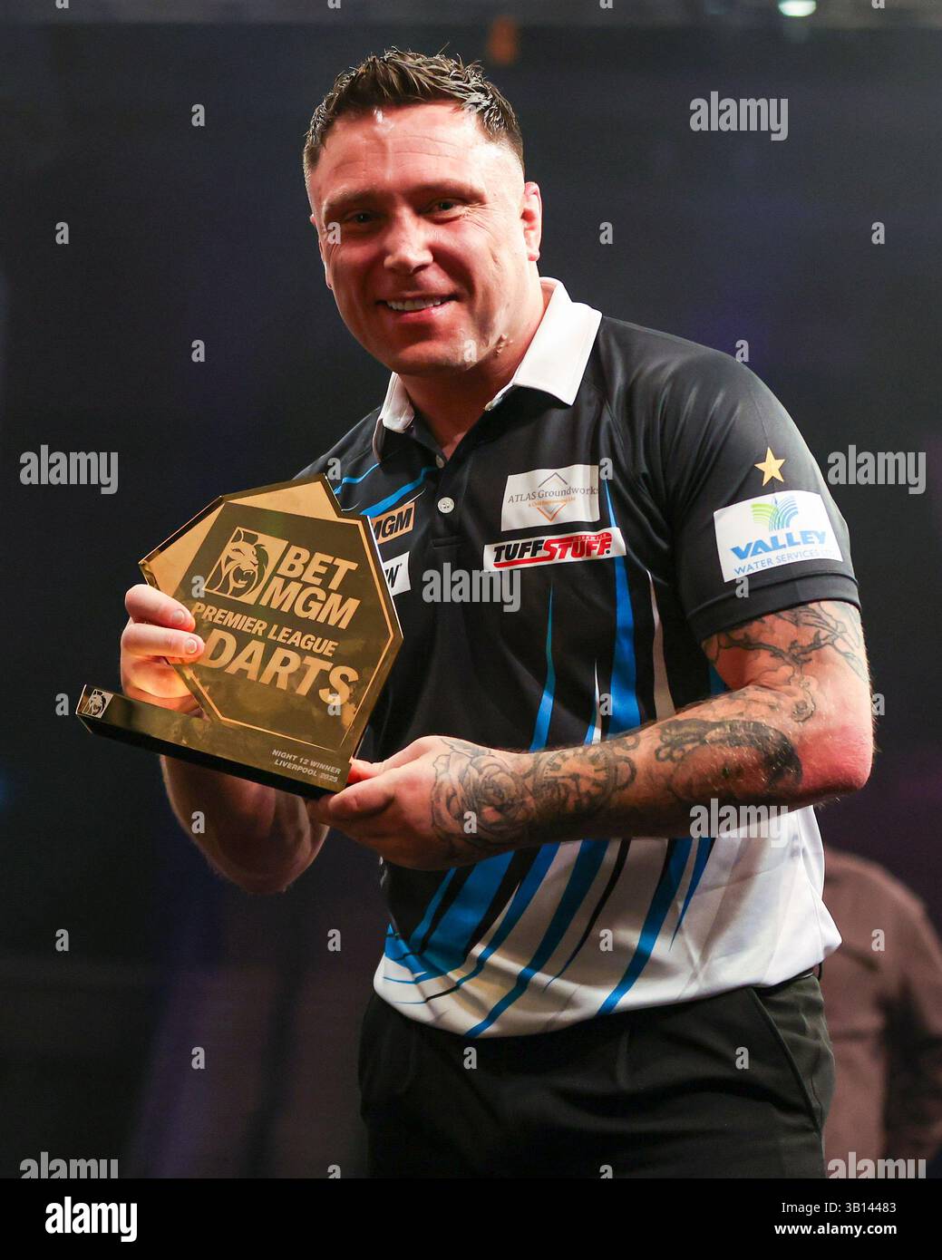 Liverpool, UK. 24th Apr, 2025. Gerwyn Price celebrates winning with the ...