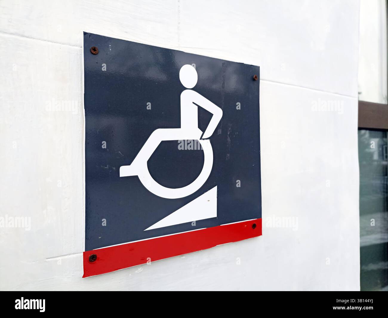 Accessible building sign with wheelchair user on ramp symbol Stock ...