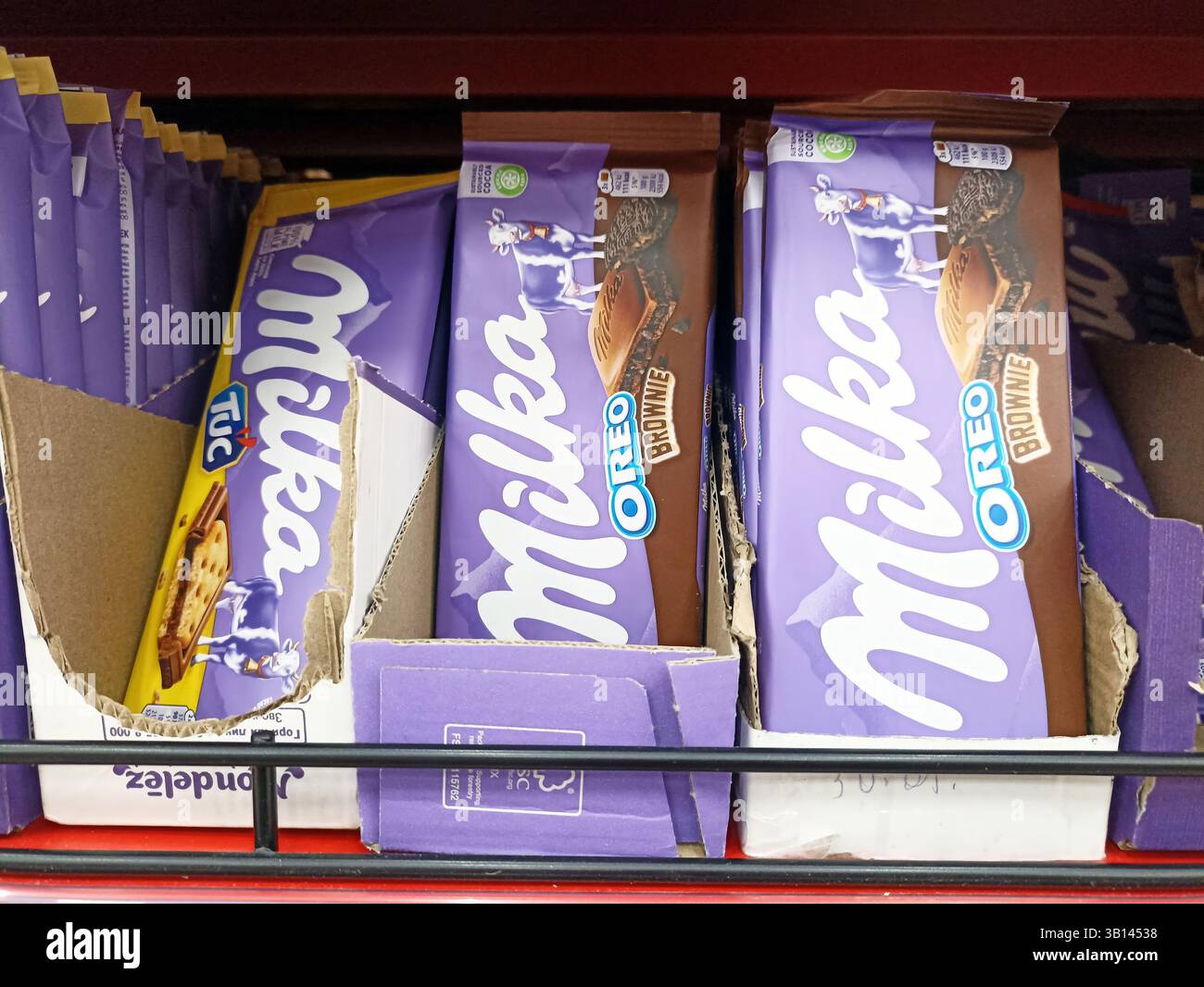 Variety of milka chocolate bars with oreo and tuc in store display ...
