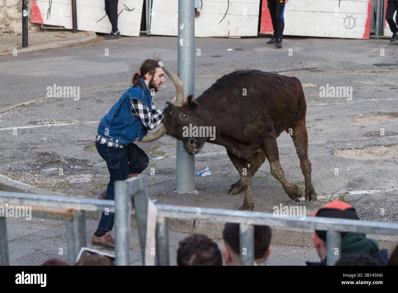 Arles, France. 18th April 2025. A man hit by a bull during Riding of ...
