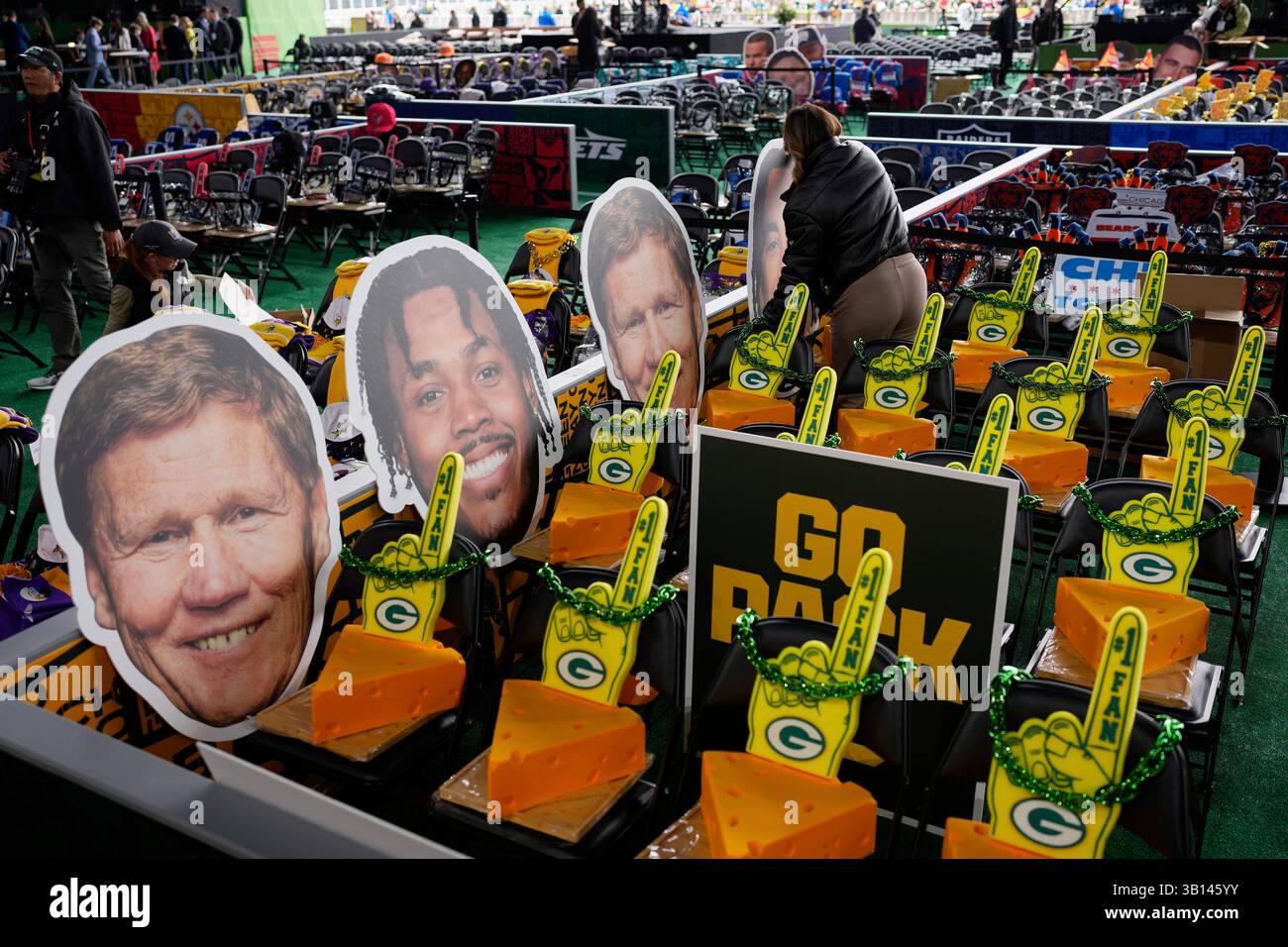 Workers set up Green Bay Packers fan's items before the first round of ...
