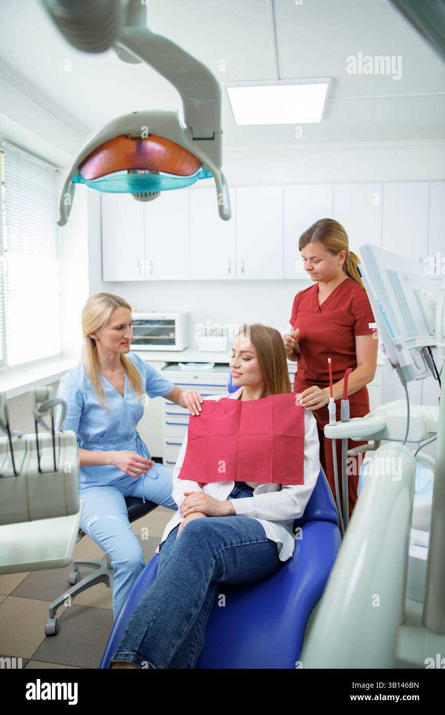 teeth whitening, dentist checking teeth, dental examination, patient's ...