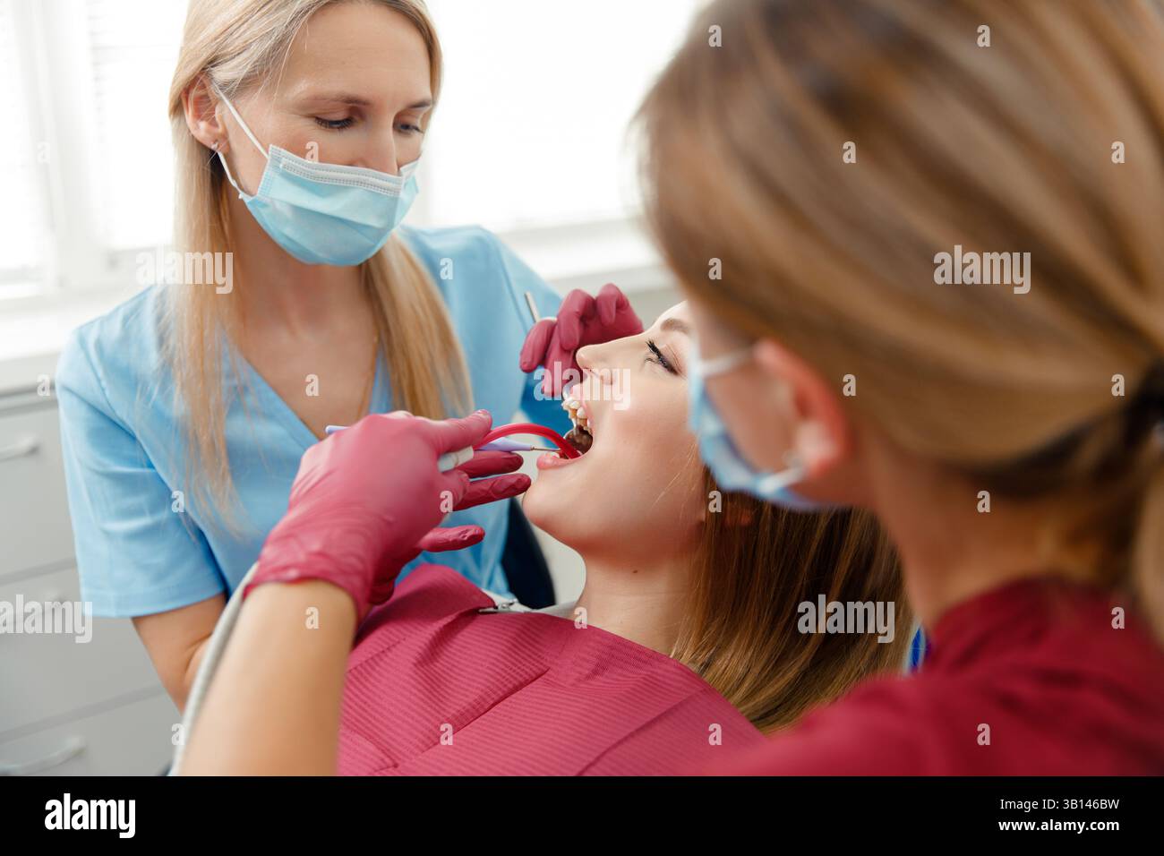 teeth whitening, dentist checking teeth, dental examination, patient's ...