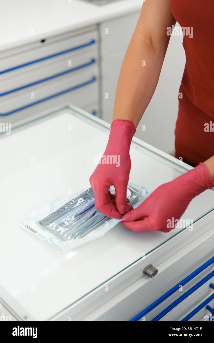 dental instruments, Dentist assistant sterilizing, packing dentist ...