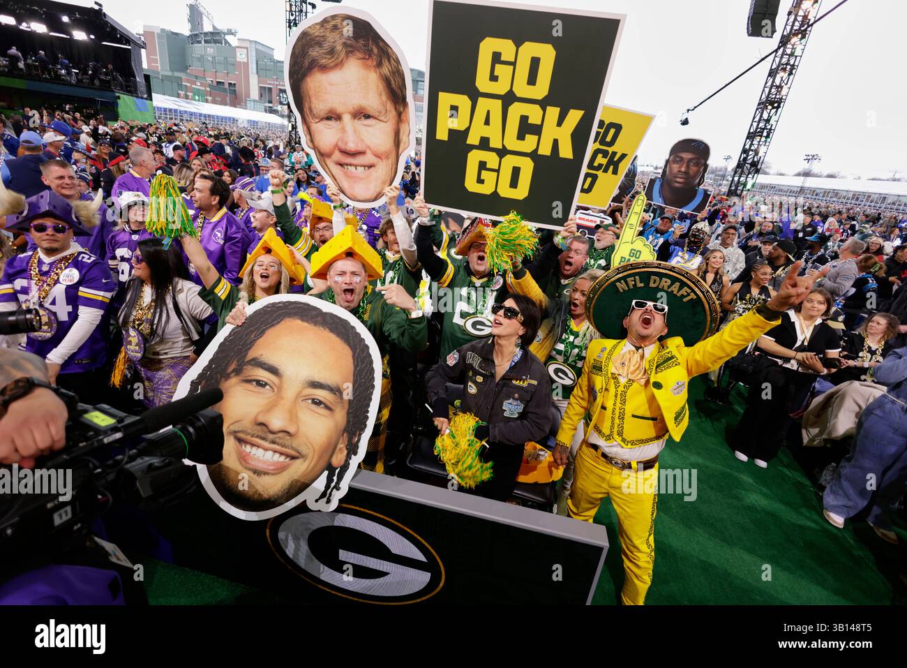 Green Bay Packers fans cheer before the first round of the NFL football ...