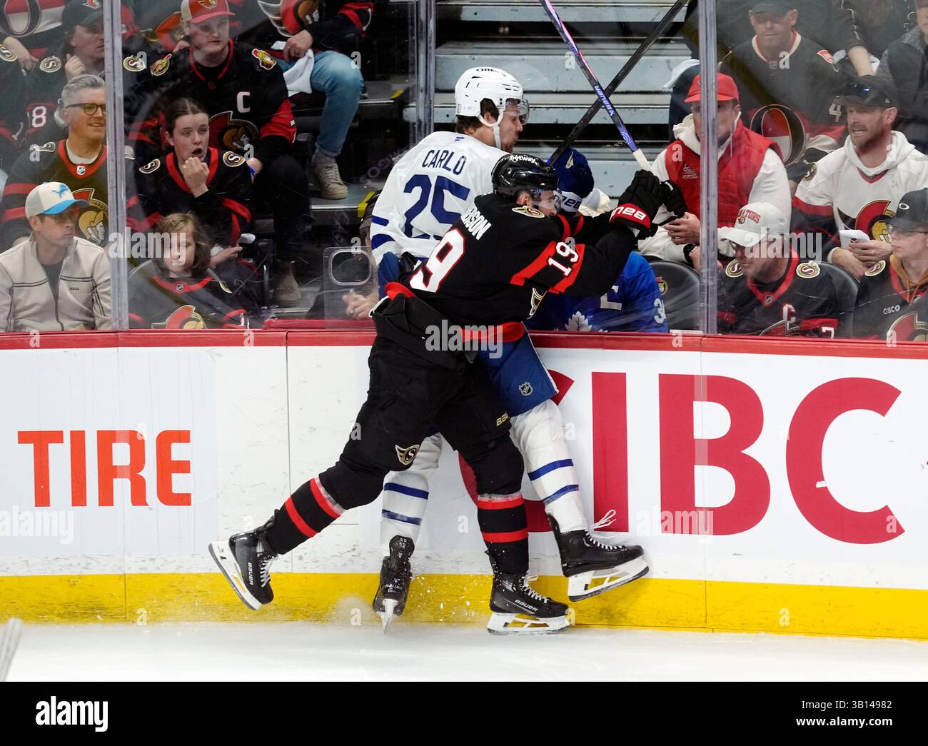 Toronto Maple Leafs defenseman Brandon Carlo (25) and Ottawa Senators ...