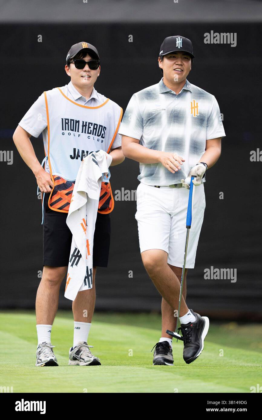Yubin Jang of Iron Heads GC and his caddie, Yoo-Min Choi, wait on the ...