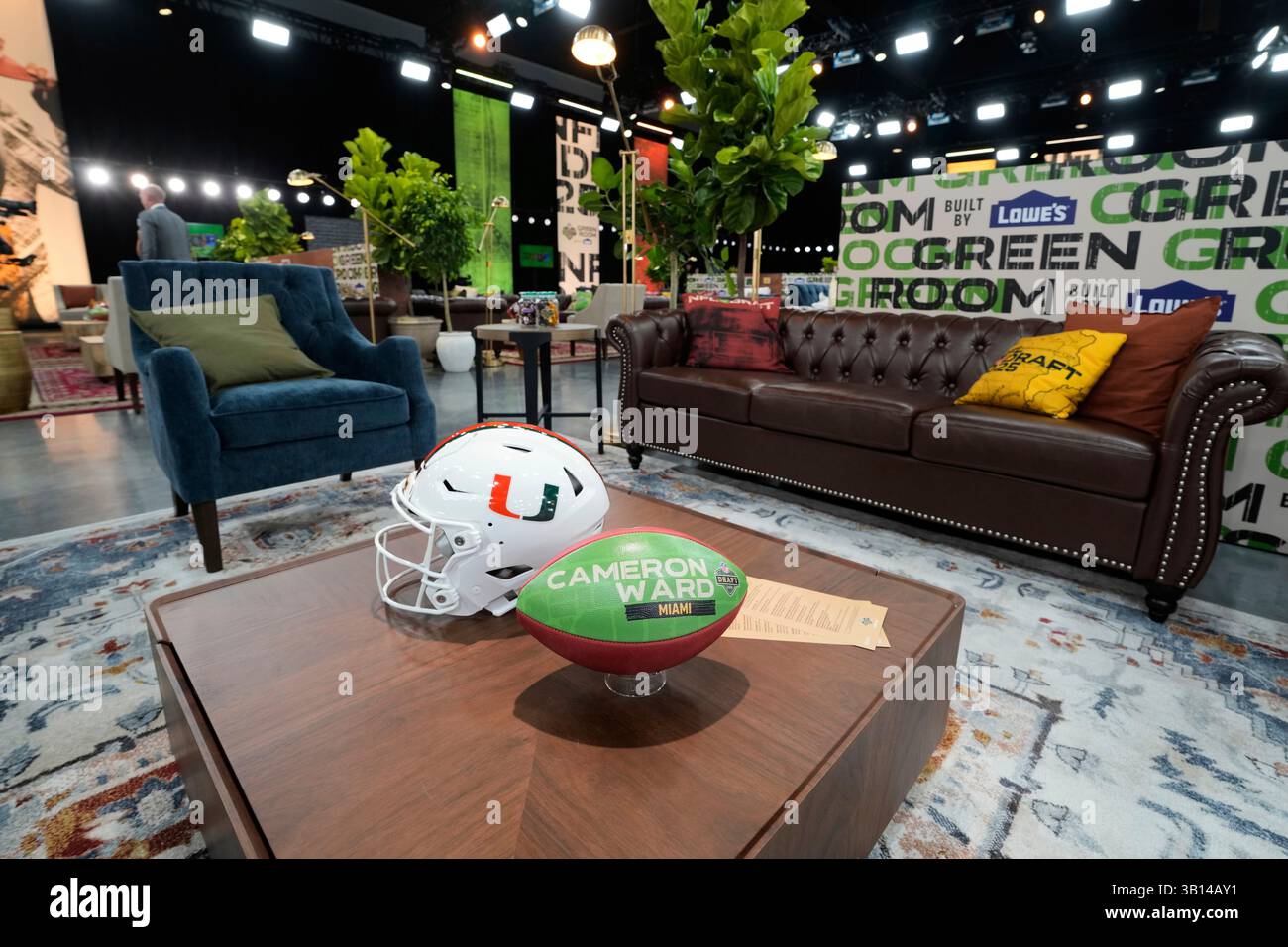 Football and helmet for Miami quarterback Cam Ward in the green room at ...