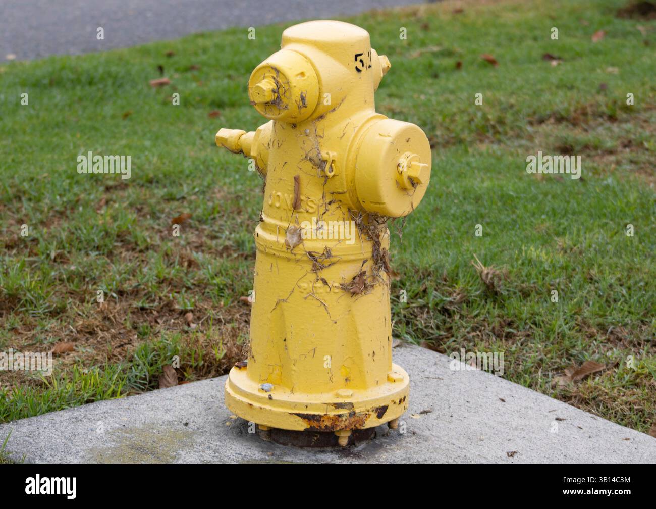 yellow fire hydrant on sidewalk Stock Photo - Alamy