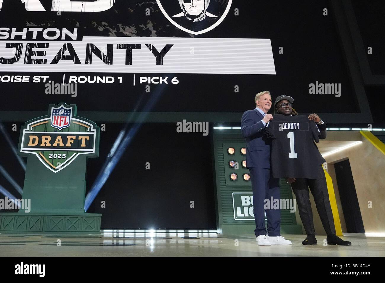 Boise State running back Ashton Jeanty, right, poses with NFL Commissioner Roger Goodell after ...