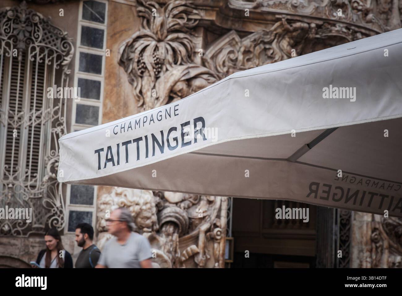 VALENCIA, SPAIN - OCTOBER 13, 2024: Branded cafe parasol with Champagne ...