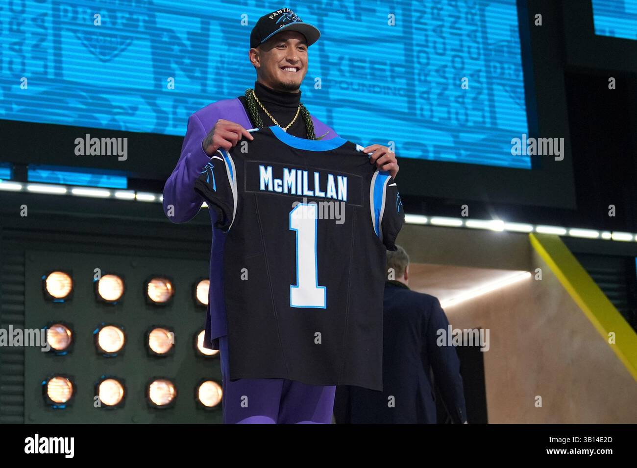 Arizona wide receiver Tetairoa McMillan poses after being chosen by the Carolina Panthers with ...